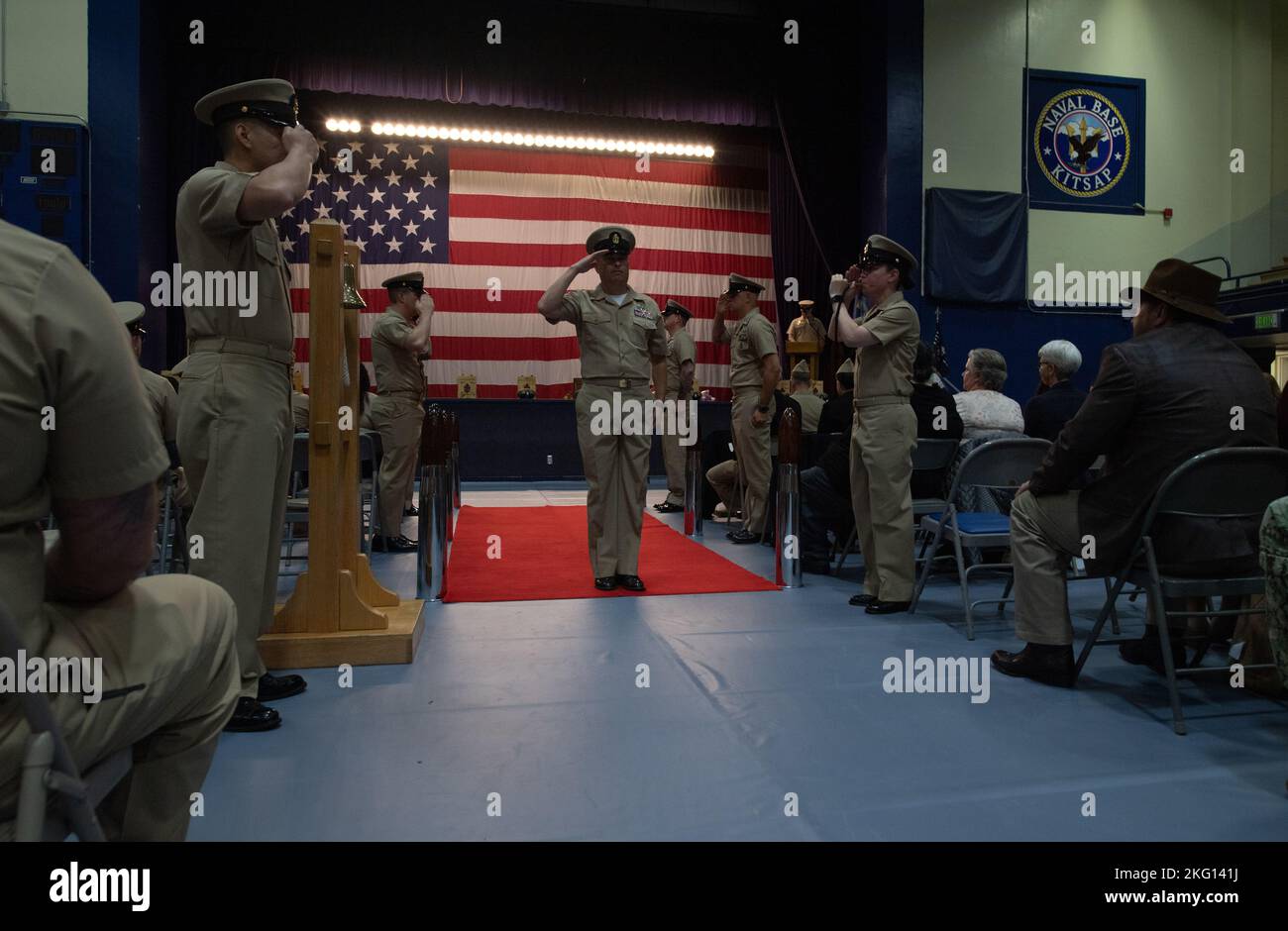 Chief Musician Alan Holland walks through sideboys as part of a chief ...