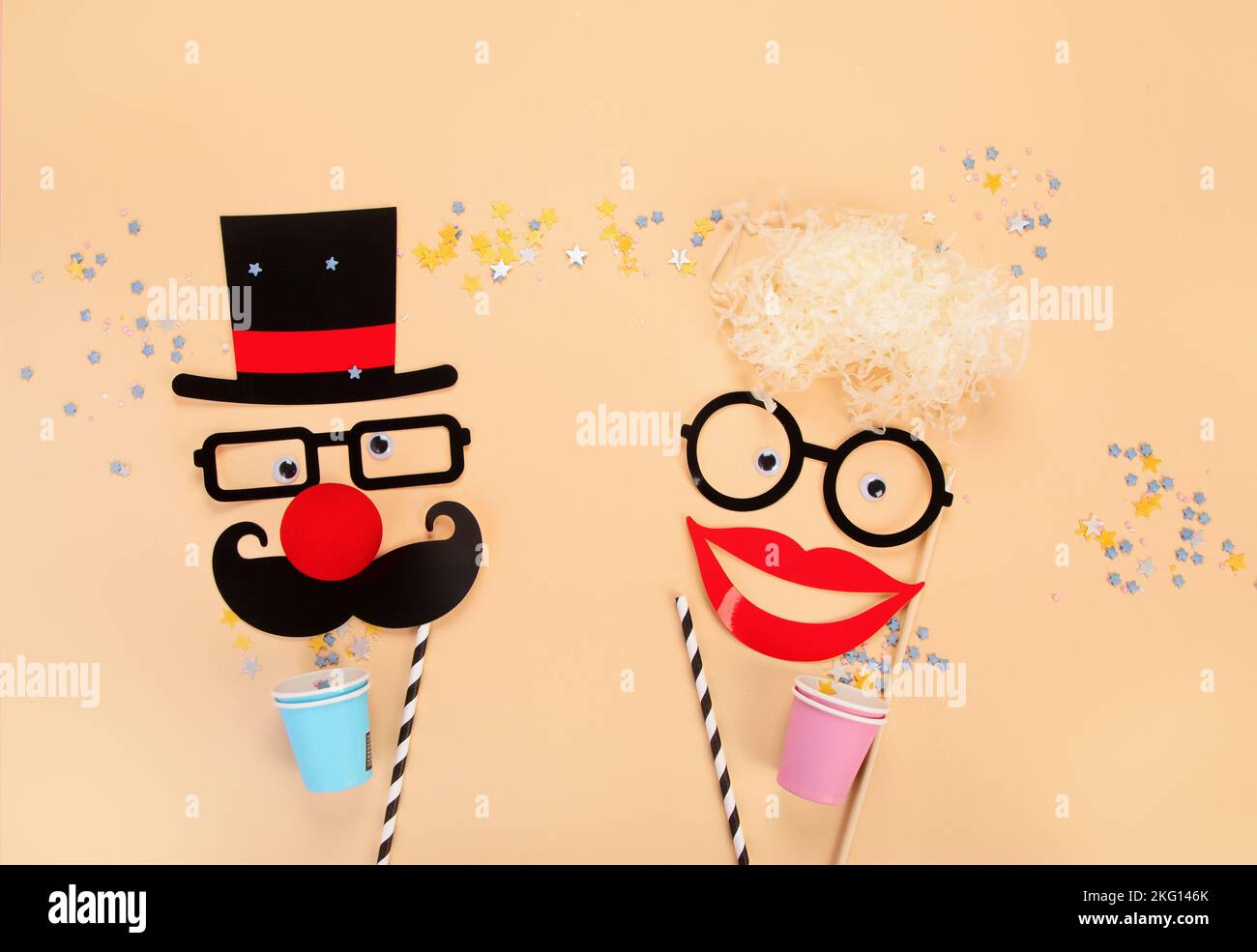 Funny faces on party pink background. Celebration concept. Top view ...