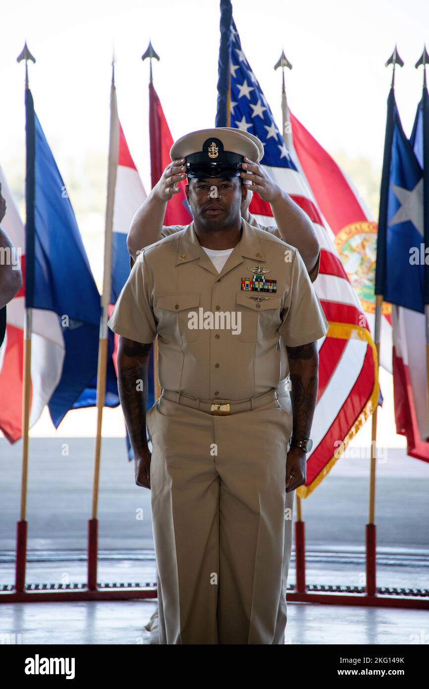 U.S. Navy Sailors participate in a chief petty officer pinning ceremony ...