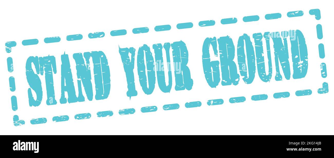 STAND YOUR GROUND text written on blue dash stamp sign Stock Photo - Alamy