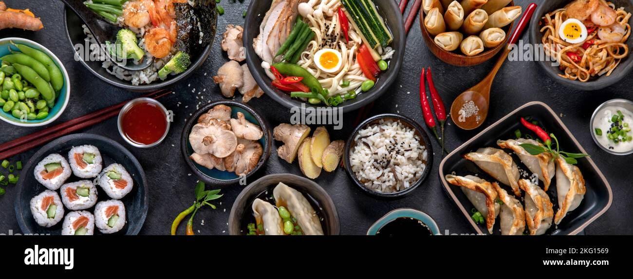 Traditional Asian food. Various of asian meals on dark background ...