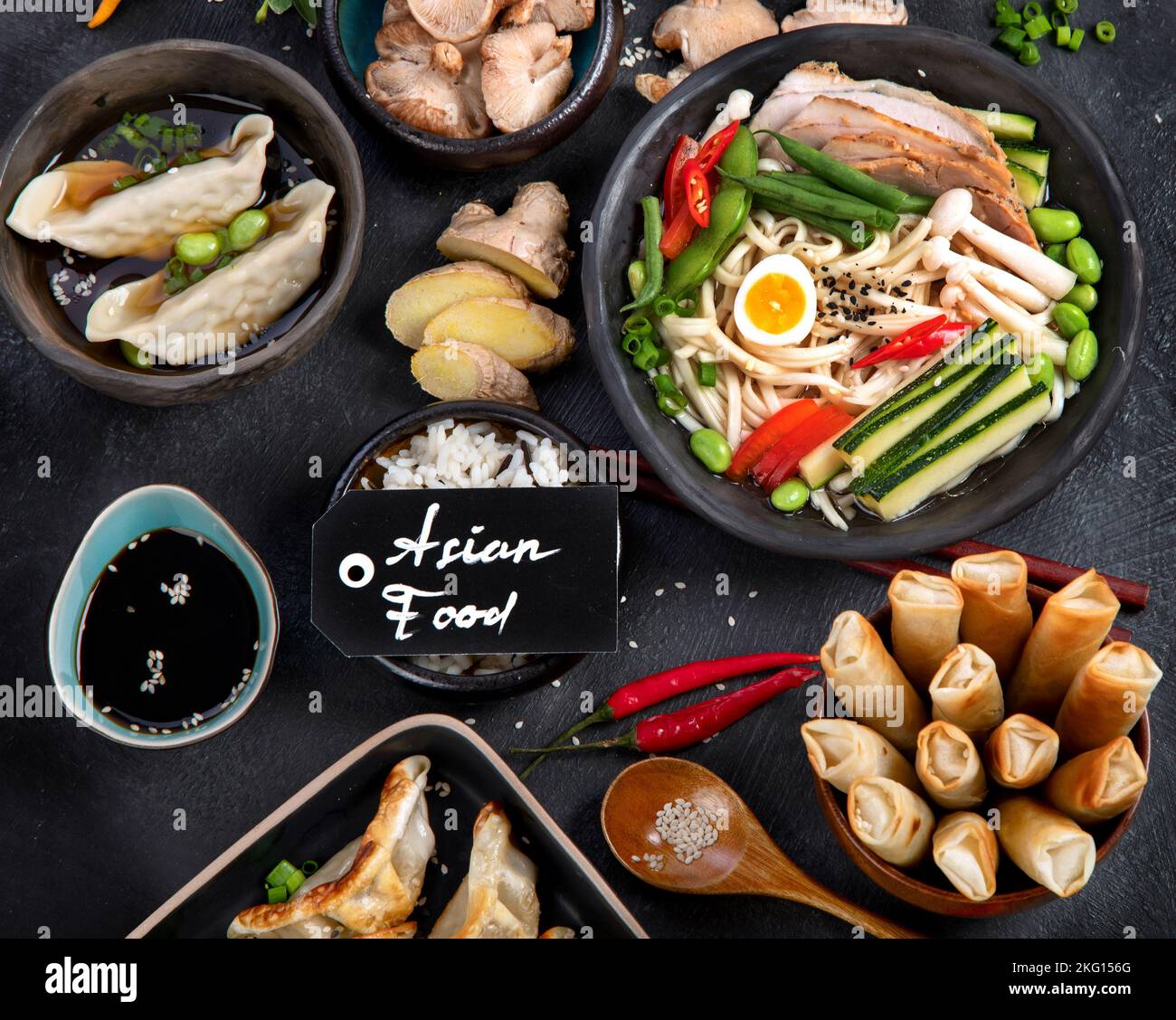 Traditional Asian food. Various of asian meals on dark background ...