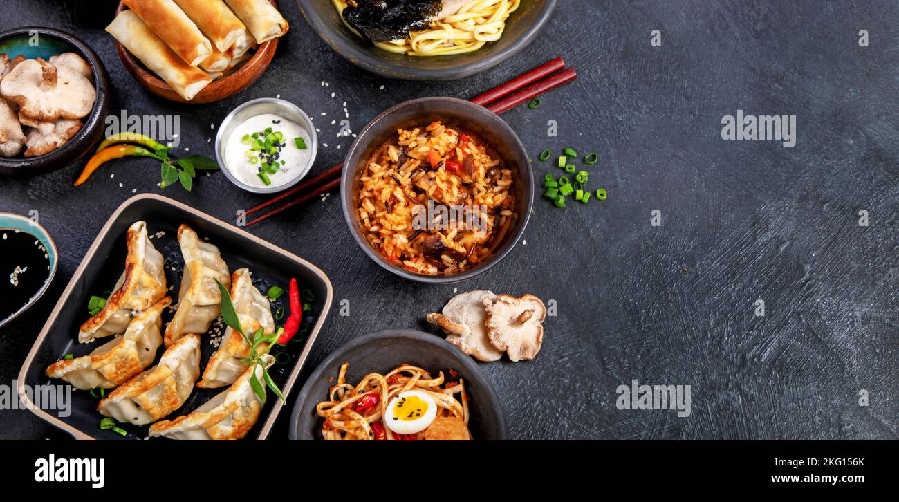 Traditional Asian food. Various of asian meals on dark background ...