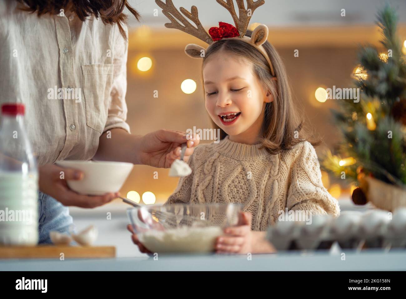 Merry Christmas and Happy Holidays. Family preparation holiday food ...