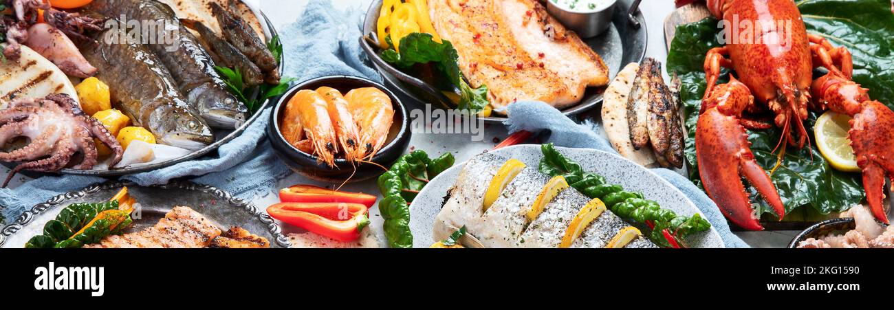 Seafood platter. Assorted delicious seafood with vegetables on a grey ...