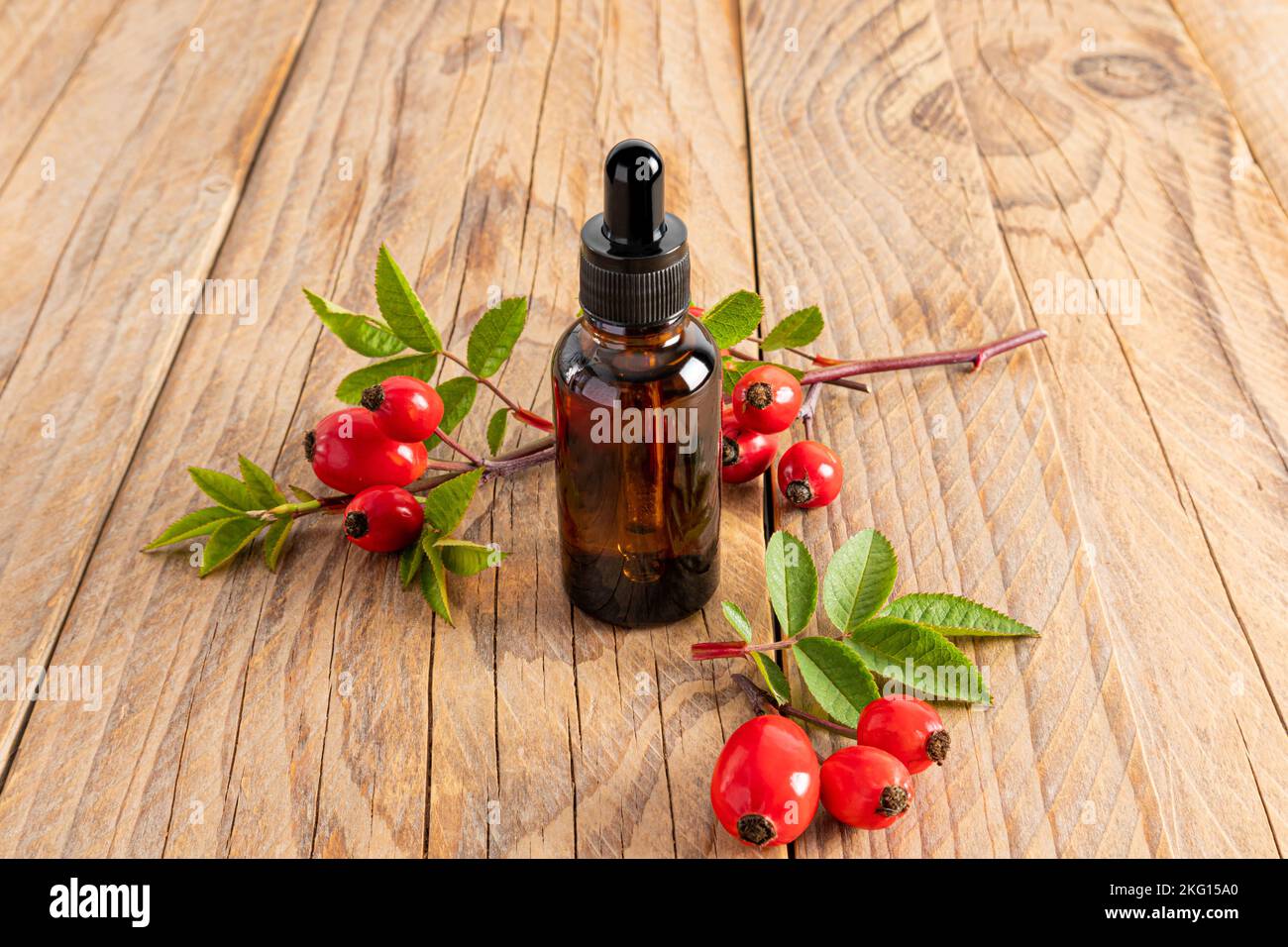 a glass bottle with a dropper with serum, a cosmetic of rosehip seeds ...