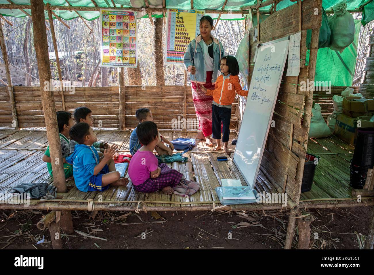 A volunteer teacher gives a lesson to children on January 27, 2022, in ...