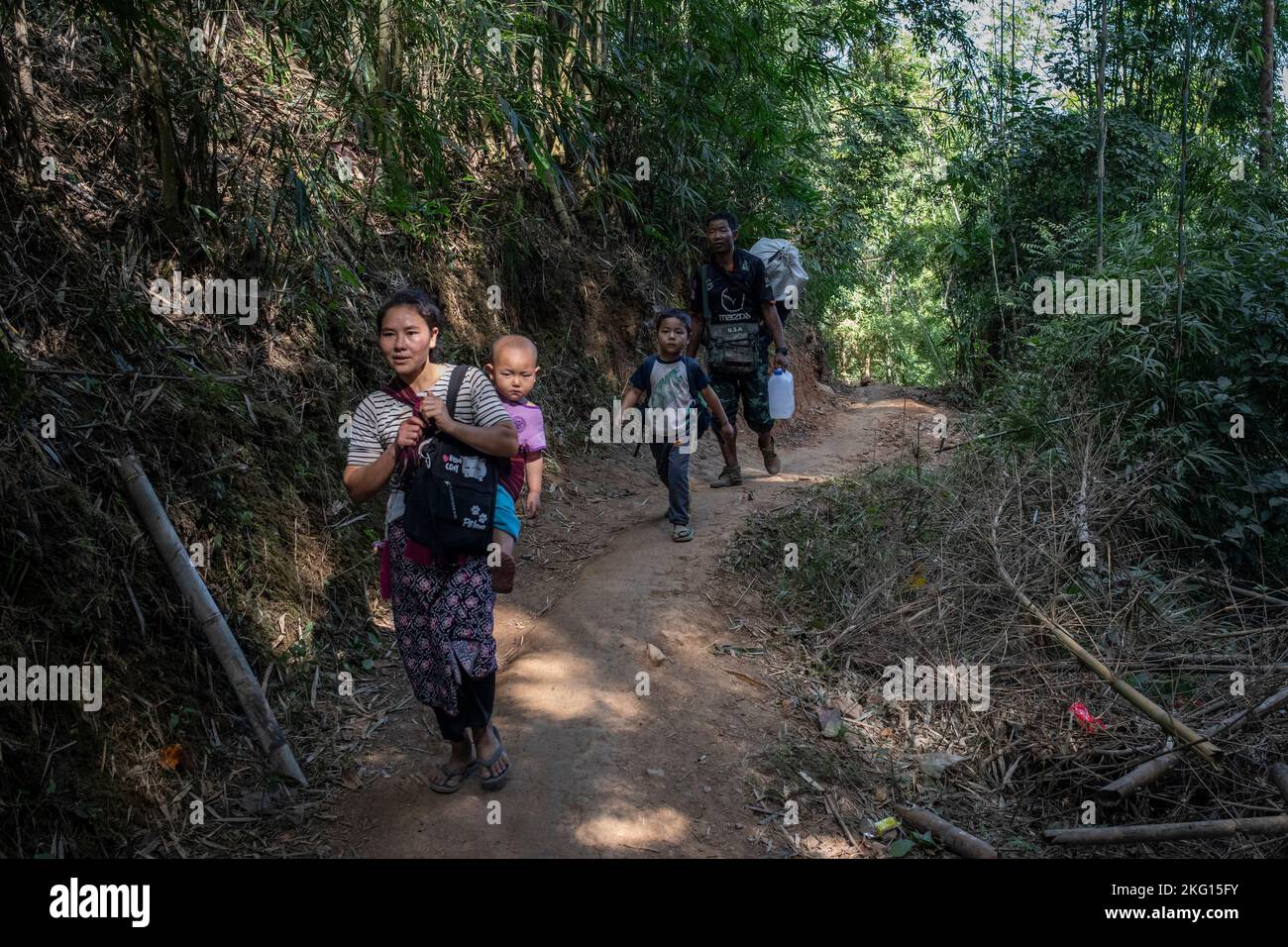 An internally displaced family recently arrives to safety close to an ...
