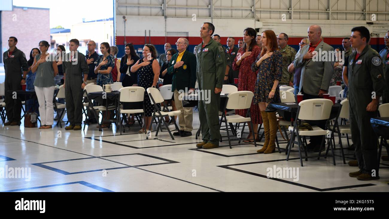 Members of the 149th Fighter Wing stand at attention while their family ...