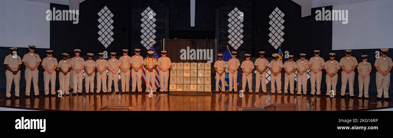 Newly pinned U.S. Navy chief petty officers pose for a photo during a ...