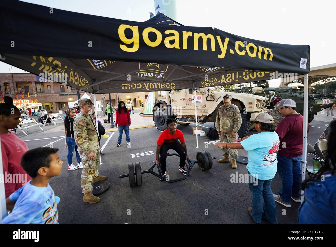 The crowd looks on as a fair goer tests their strength at the South ...