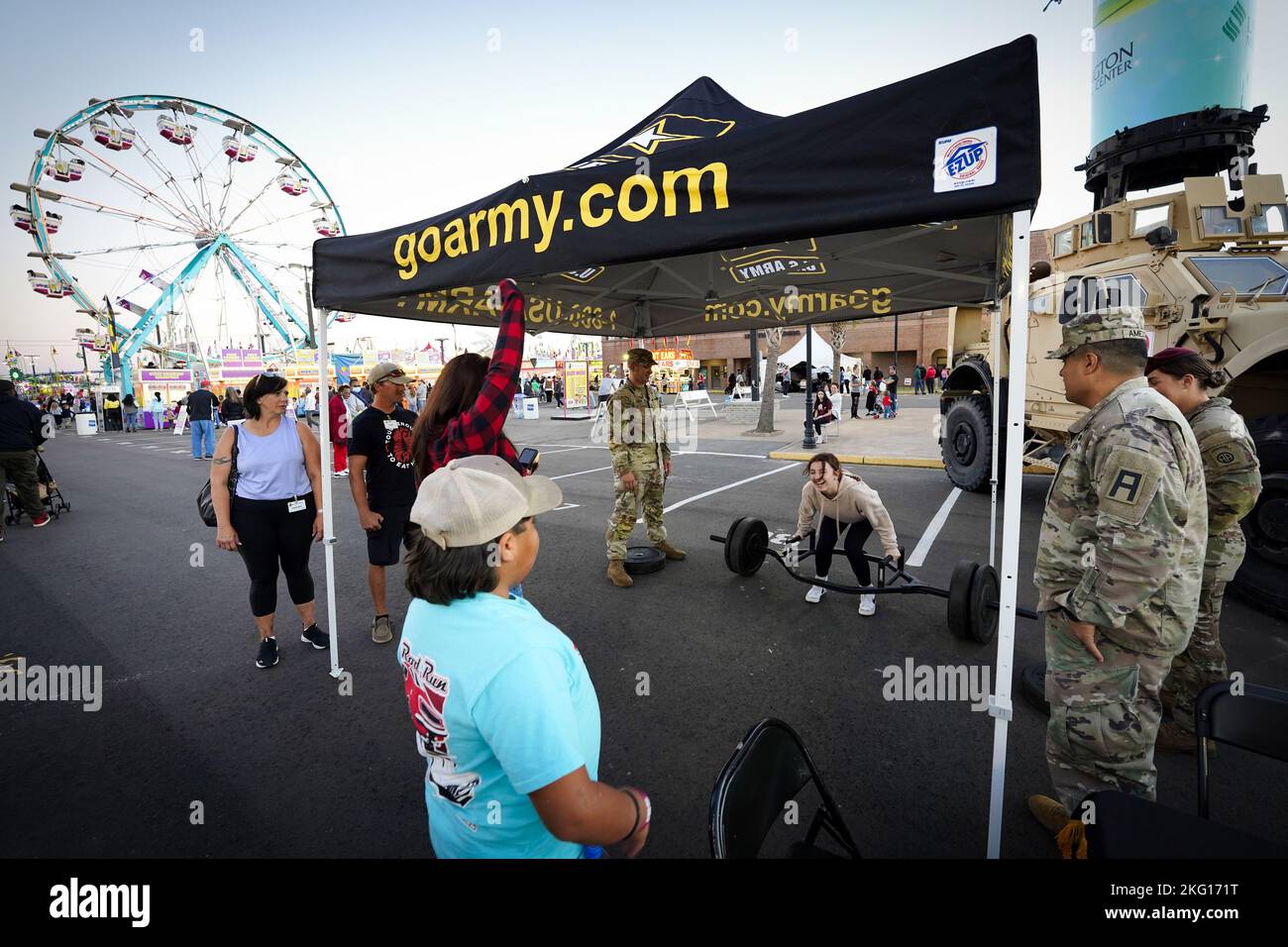 The crowd looks on as a fair goer tests their strength at the South ...
