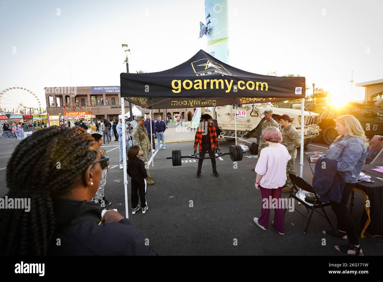 The crowd looks on as a fair goer tests their strength at the South ...