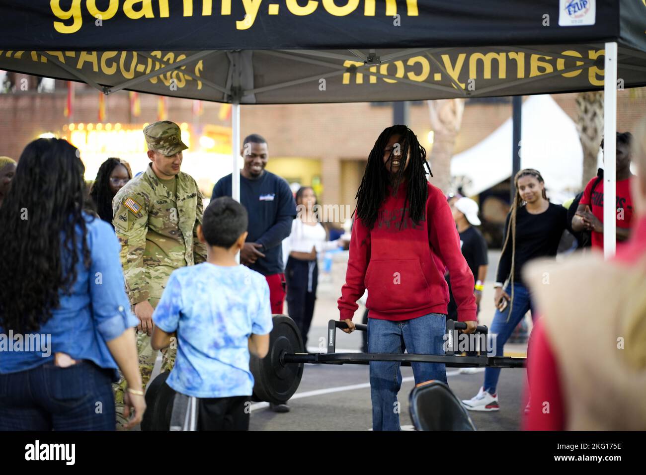 The crowd looks on as a fair goer tests their strength at the South ...