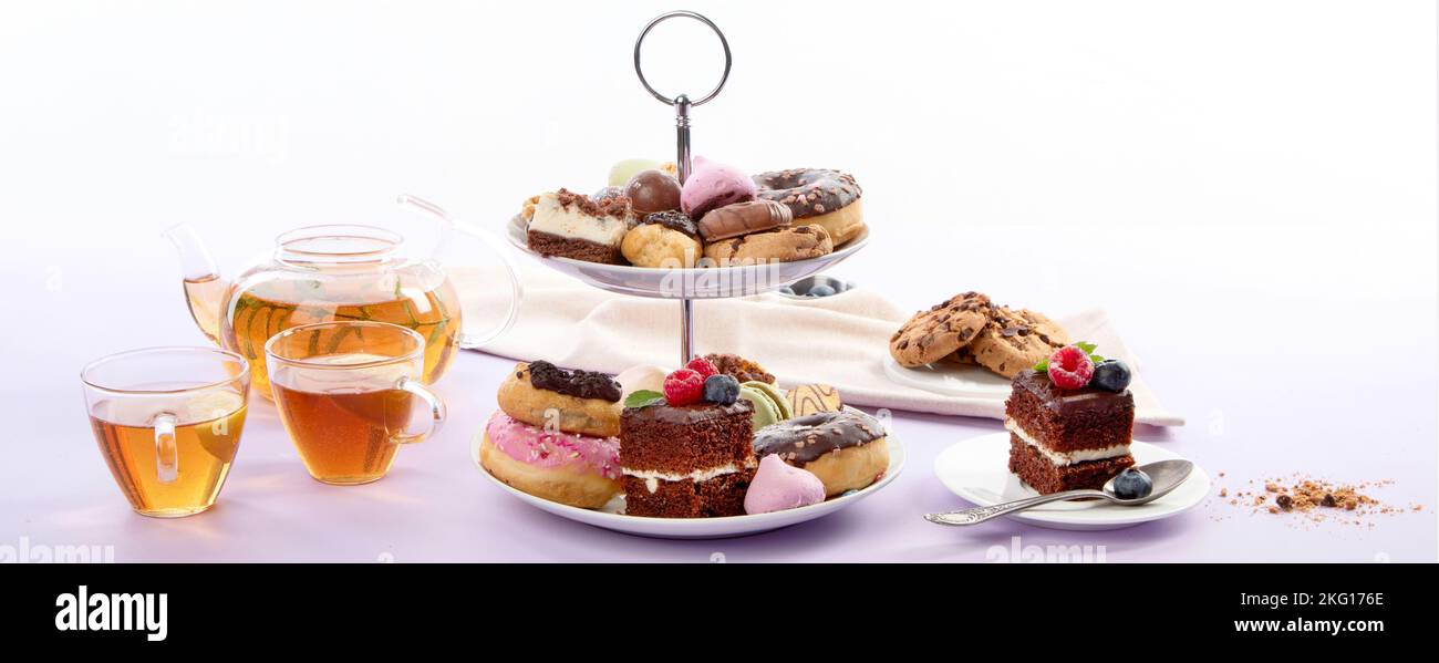Traditional English tea. Afternoon tea with selection of sweets on ...
