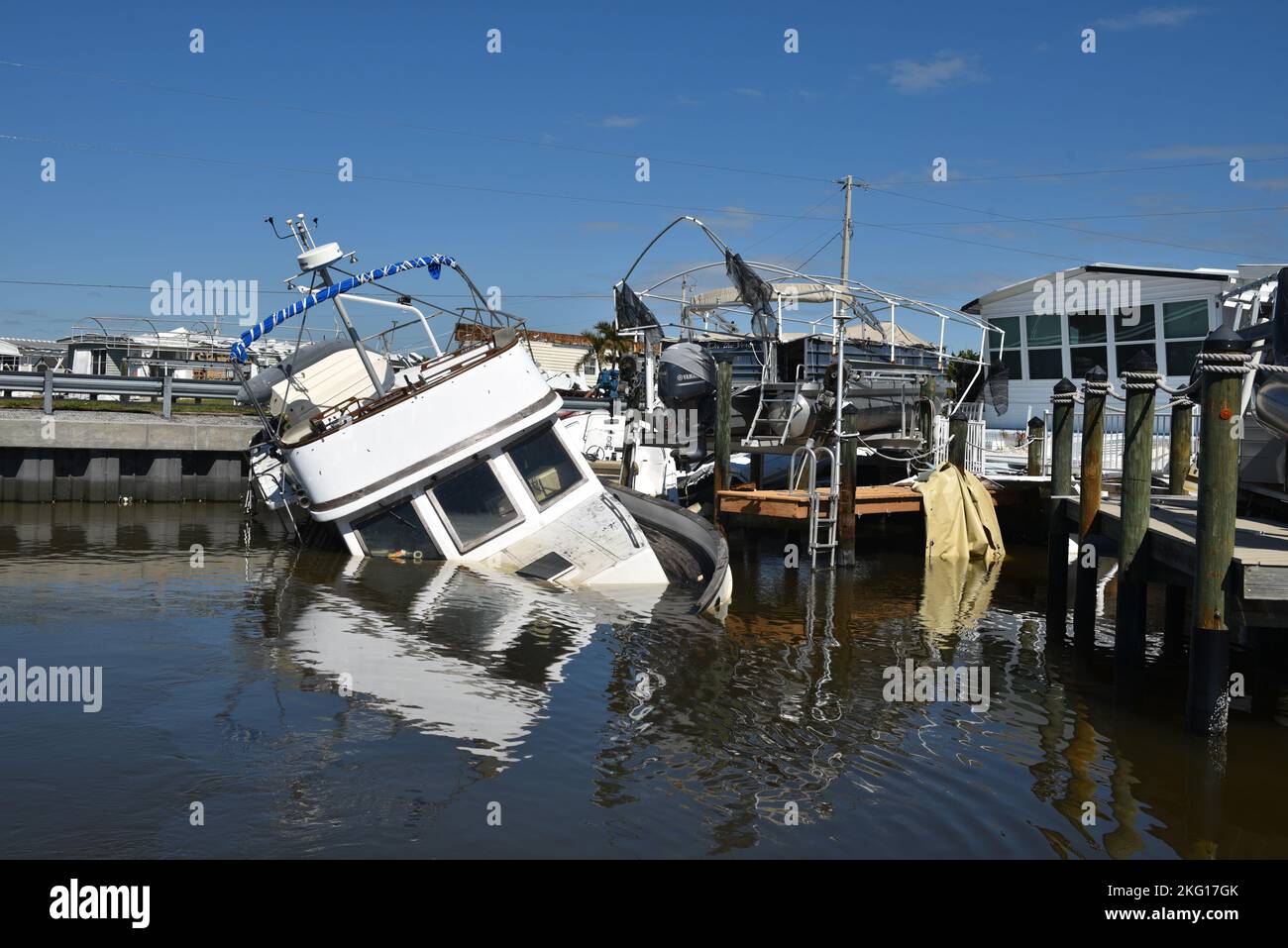 A vessel sinks in a residential canal post Hurricane Ian, in Ian Island ...