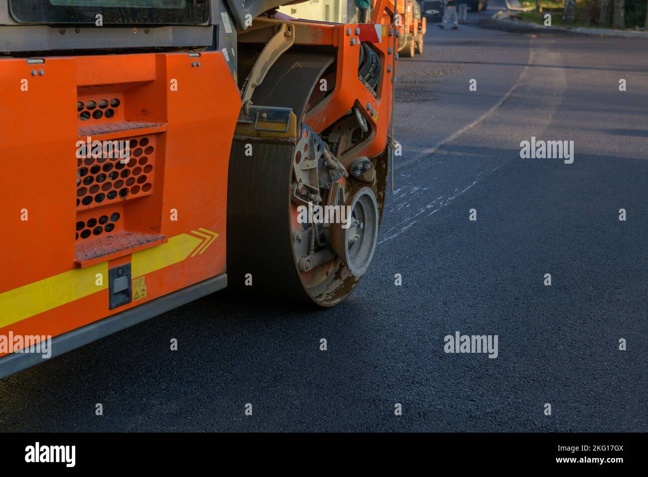 Road construction background. Heavy vibration roller compactor at work ...