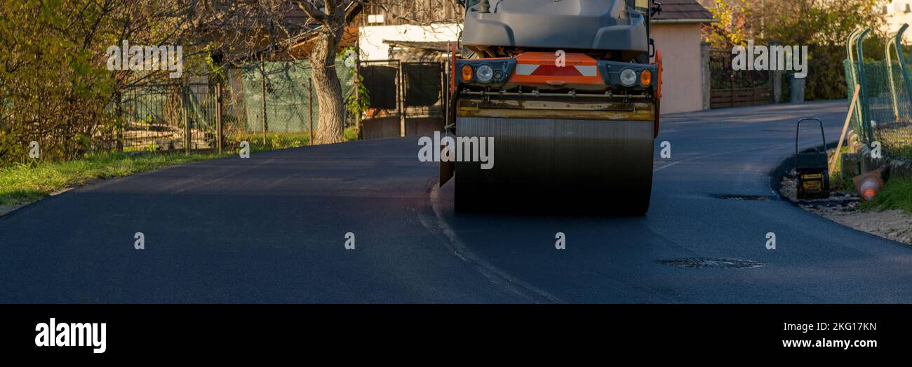Road construction background. Heavy vibration roller compactor at work ...