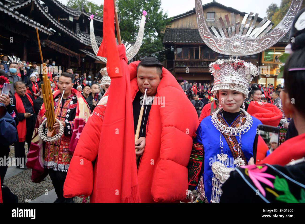 The Hmong girls in holiday attire are dancing the traditional Lusheng ...