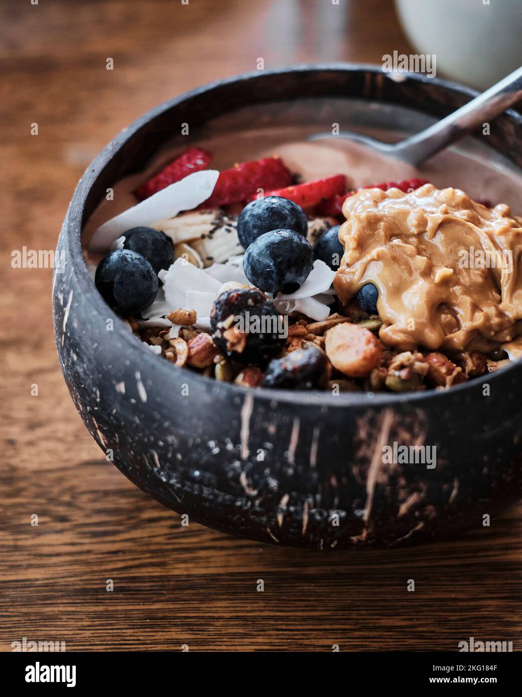 Healthy Acai Brekkie served in a Coconut Shell Stock Photo - Alamy