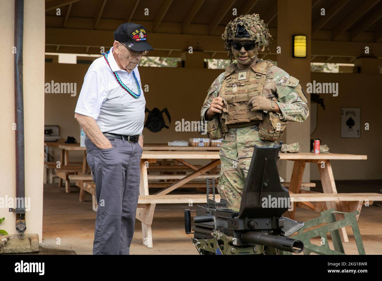 Private 2nd Class (ret.) Warren H. Schuster is shown weapon systems by ...