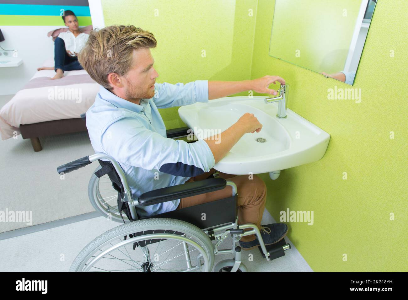 handicapped man using bathroom in hotel room Stock Photo - Alamy