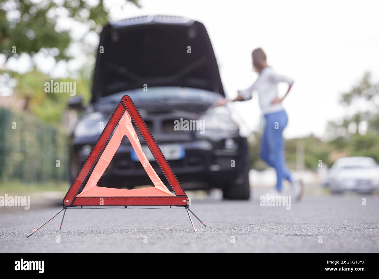 red triangle of a car on the road Stock Photo - Alamy
