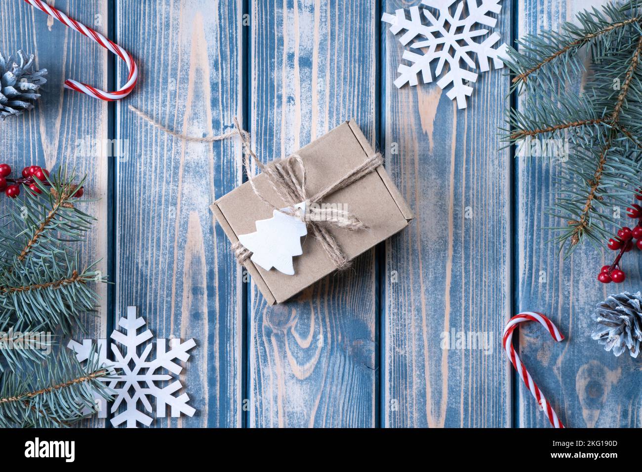 Kraft cardboard gift box tied with rough jute rope on gray wooden ...