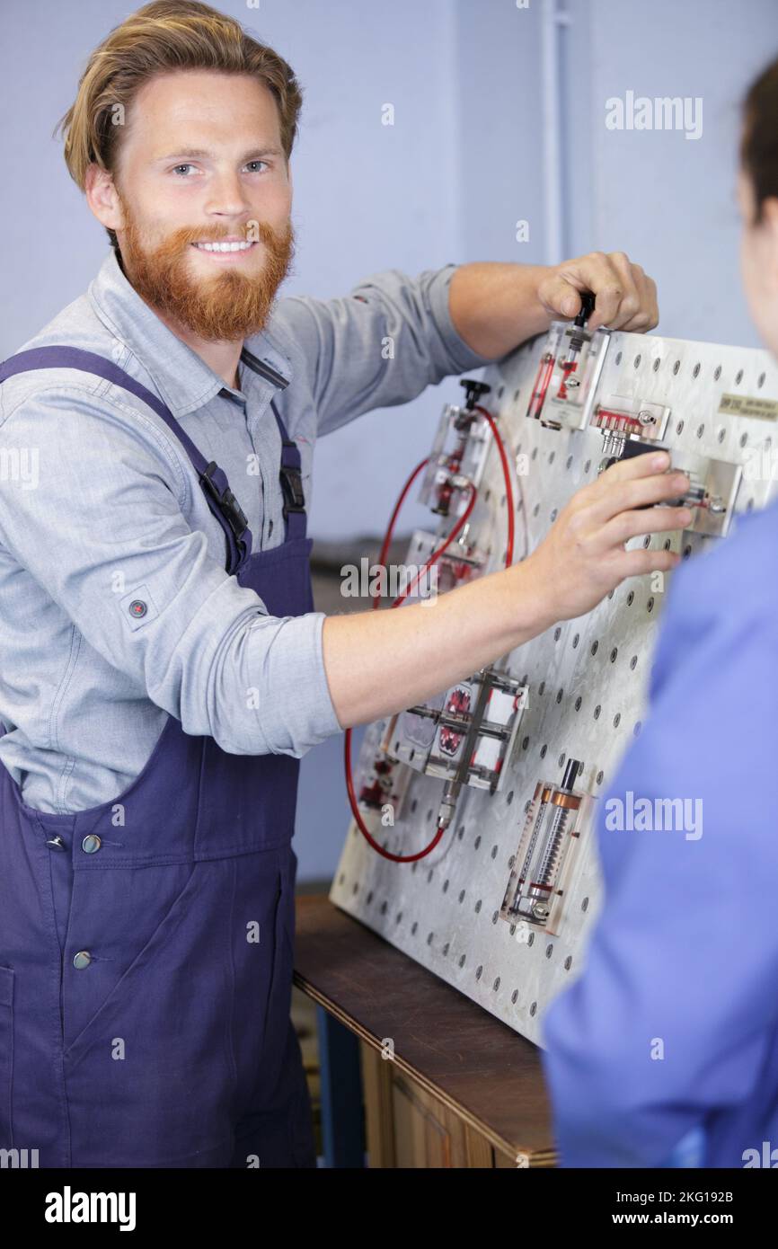 happy young electrician worker with cables in hand Stock Photo - Alamy