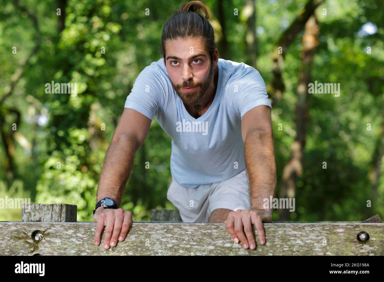 a man stretching leg muscle Stock Photo - Alamy