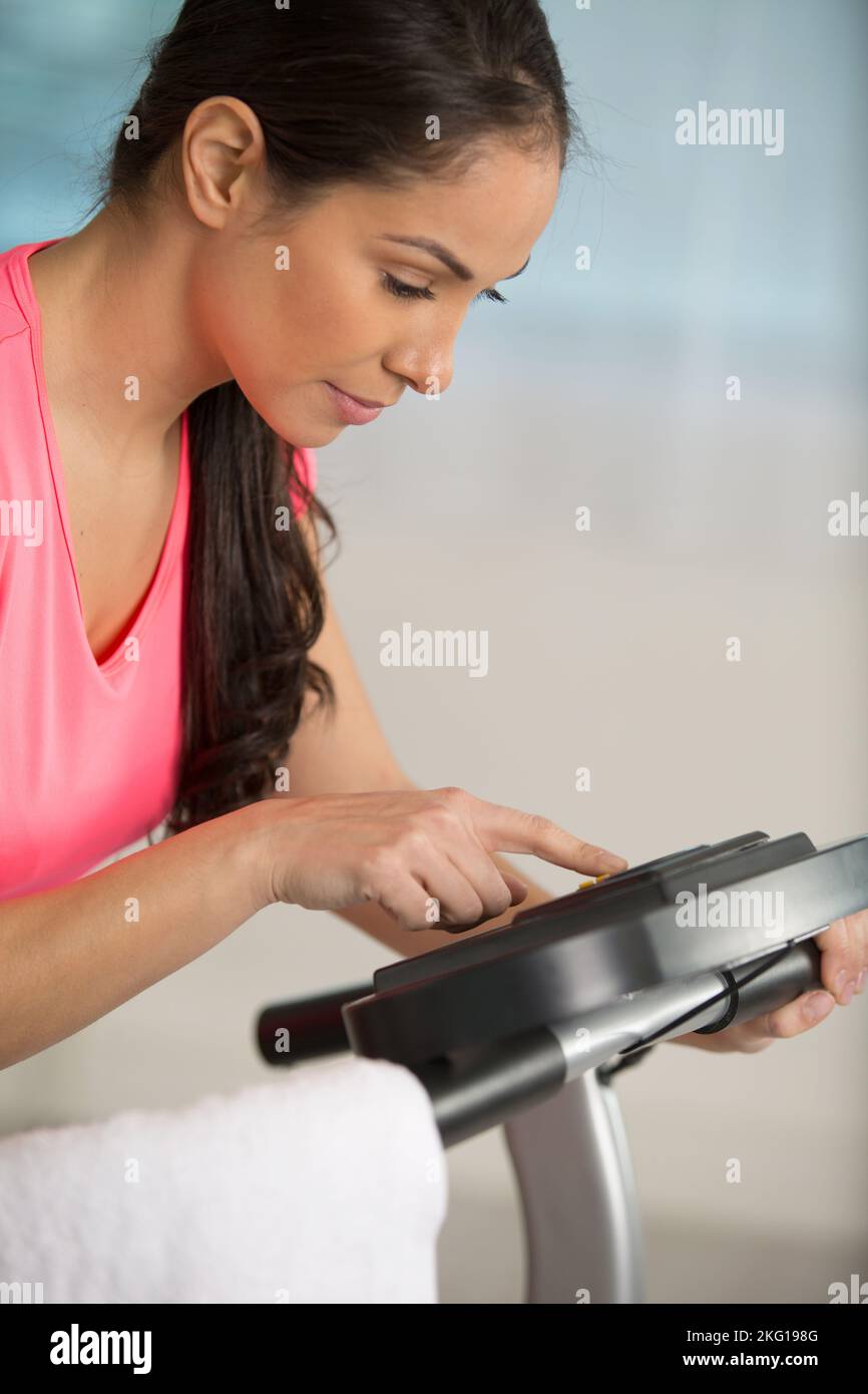 woman is exercising on step machine Stock Photo - Alamy