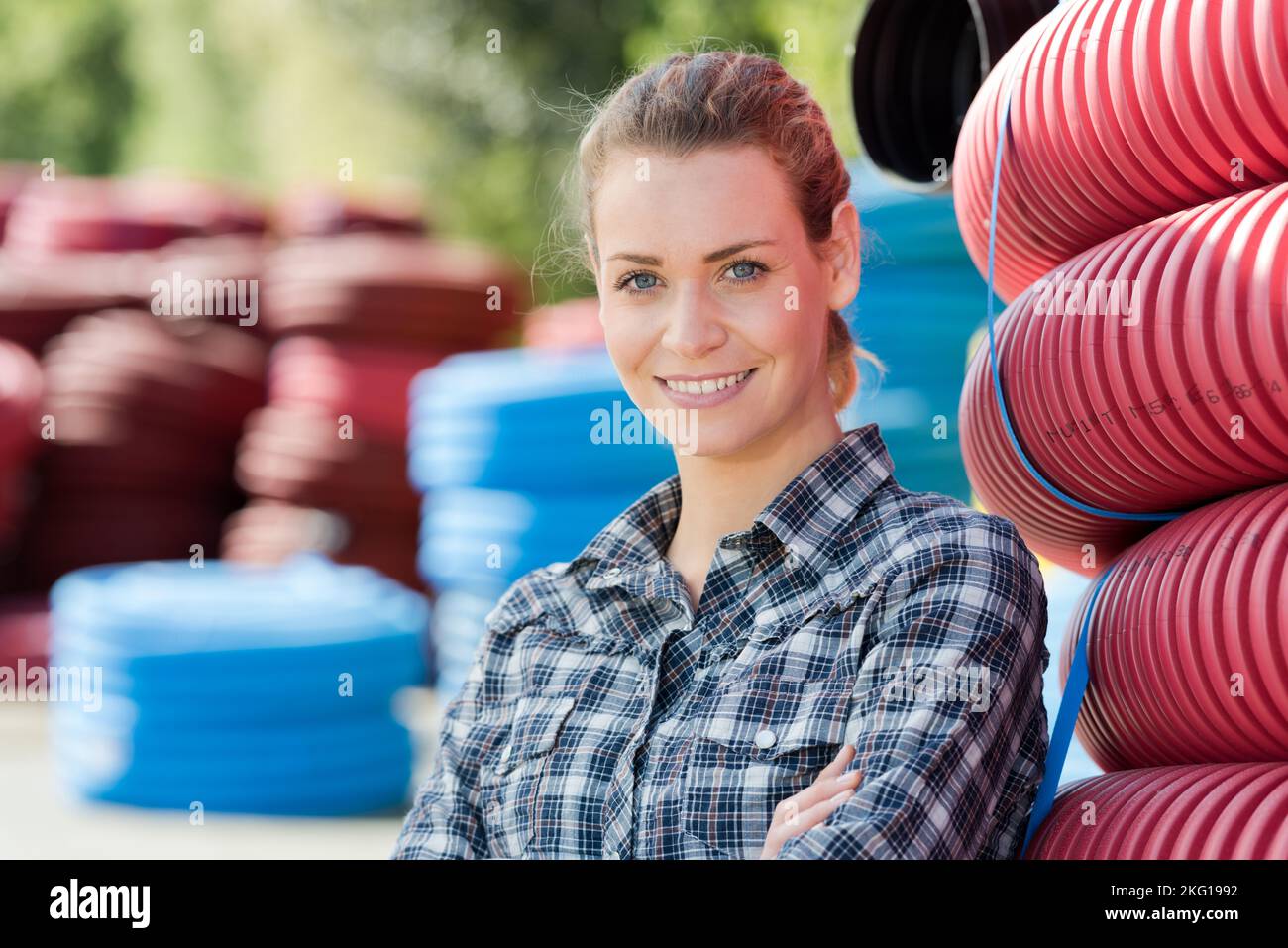 woman posing next to big electrical tubes Stock Photo - Alamy