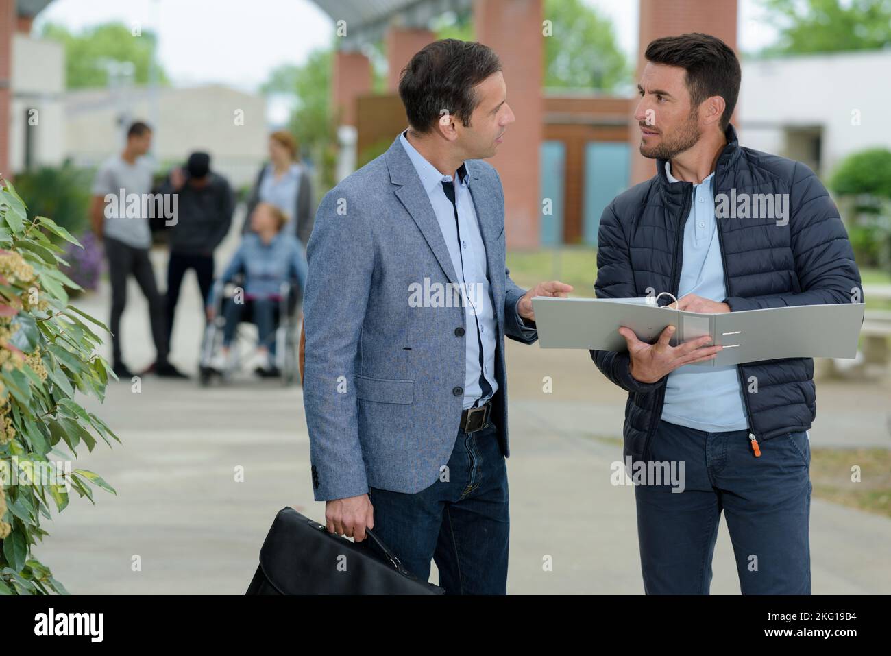 student asking professor about a concern Stock Photo - Alamy