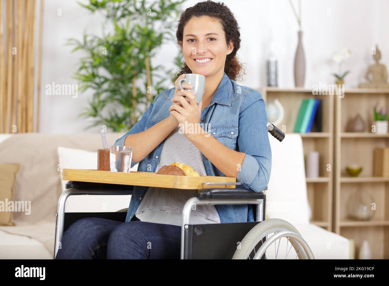 young disabled woman drinking coffee Stock Photo - Alamy