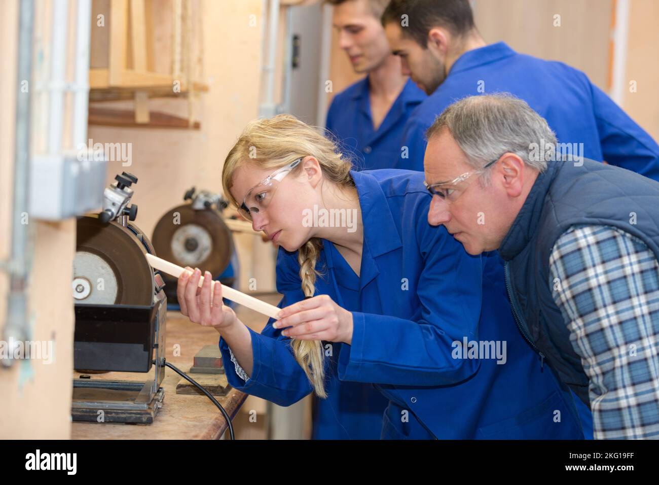 woman as apprentice of craftsman Stock Photo - Alamy