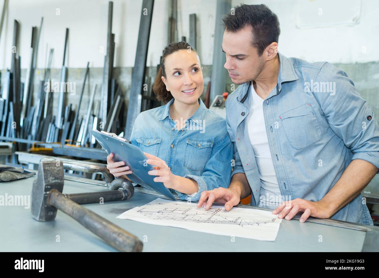 engineers working together in a factory Stock Photo - Alamy