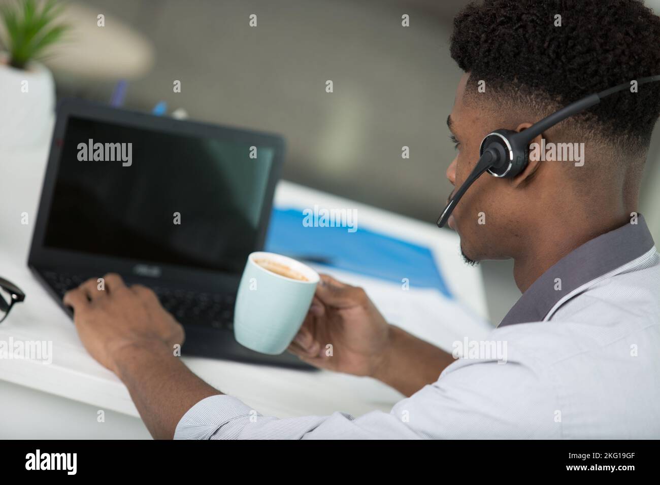 handsome young man typing something at working place Stock Photo - Alamy