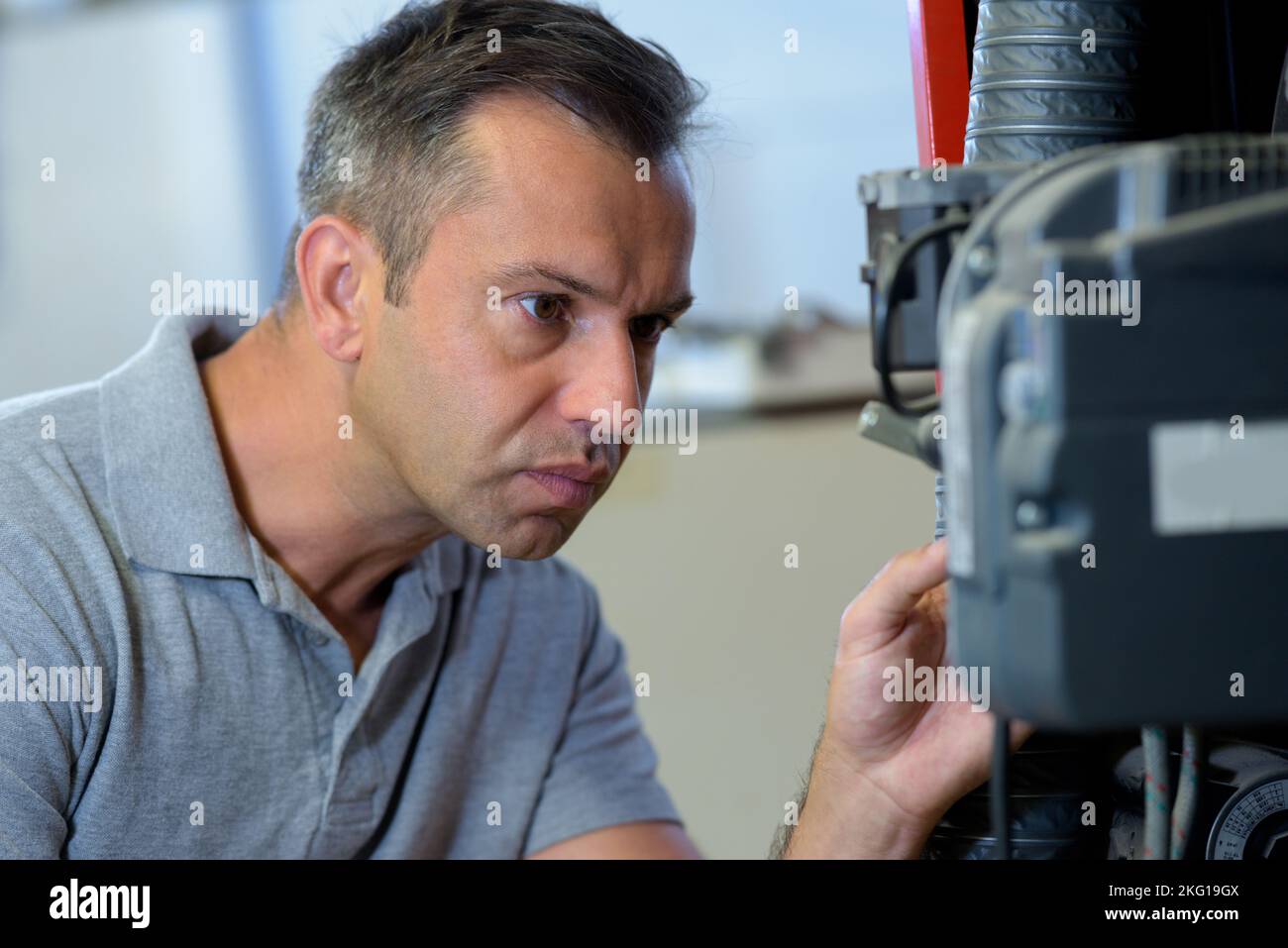 man inspecting a car engine Stock Photo - Alamy