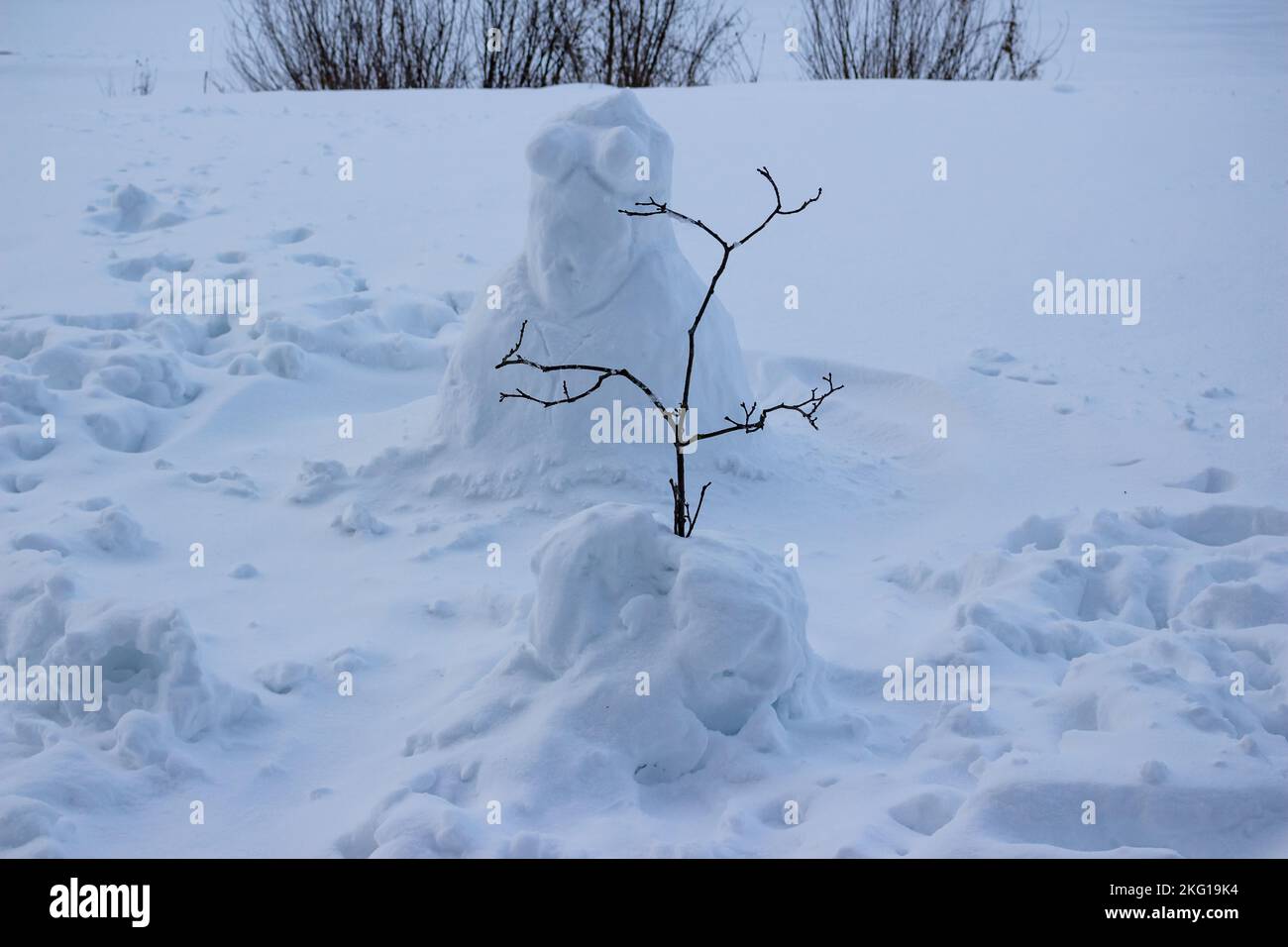A snowman made of snow and a broken on the street in winter Stock Photo ...