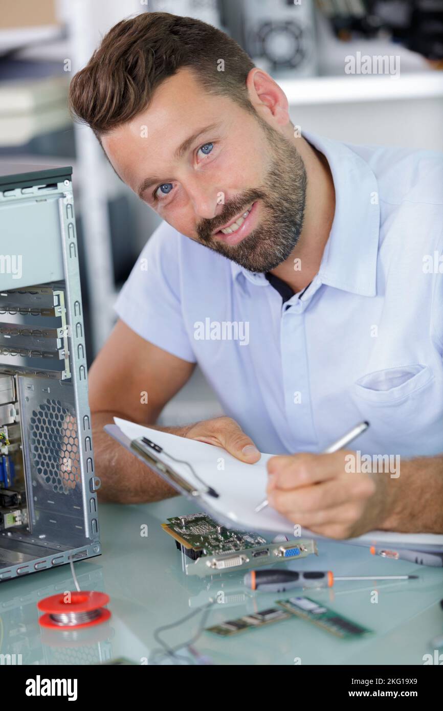 a technician repairing a computer Stock Photo - Alamy