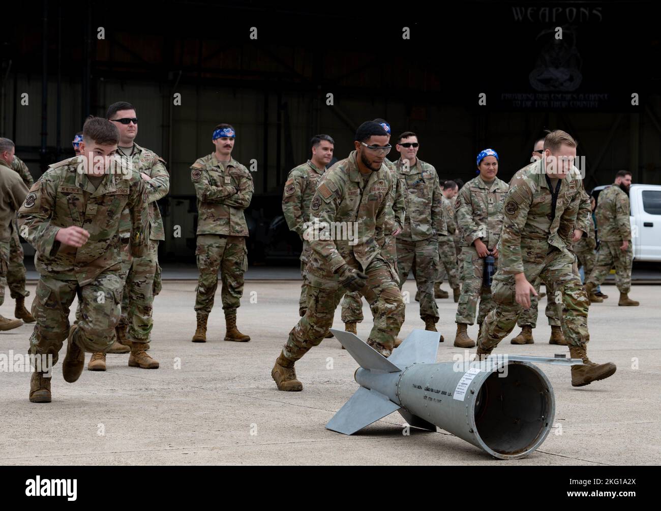 Members of the 80th Fighter Generation Squadron weapons load crew team ...
