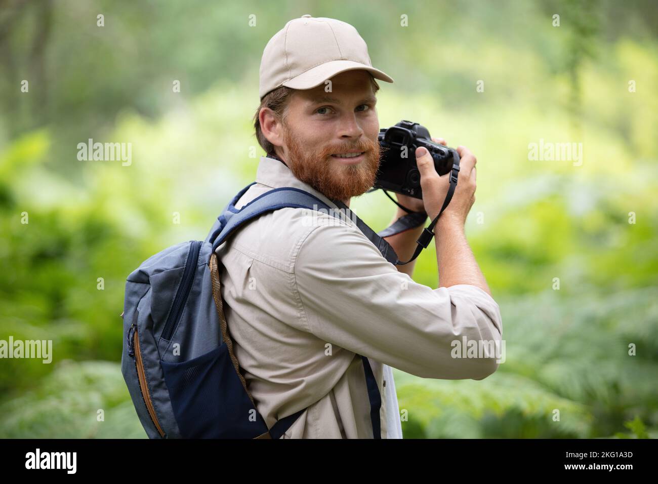 portrait of photographer taking pictures in natural landscape Stock ...