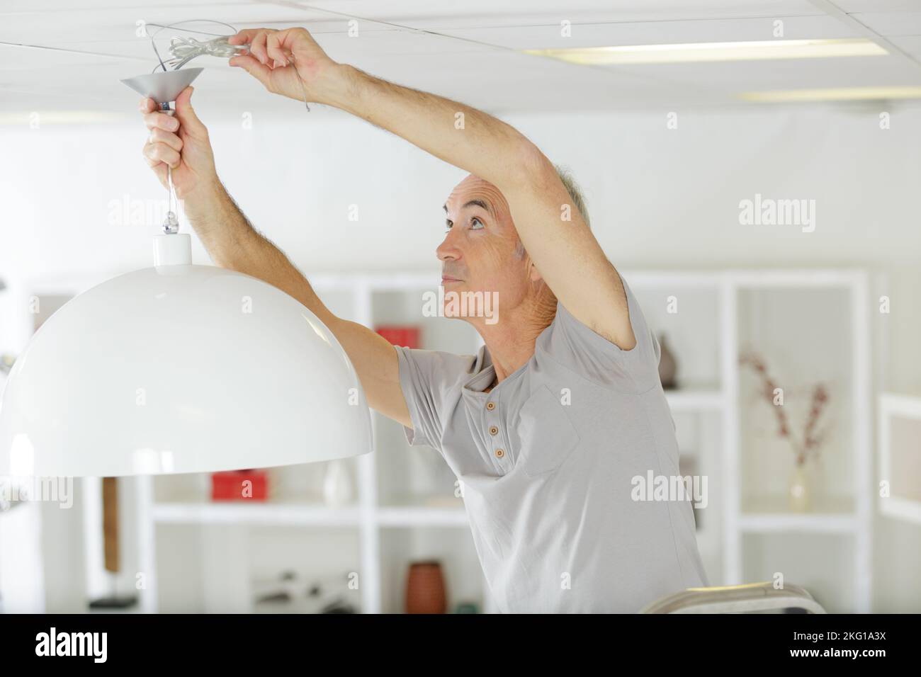 installing a lamp at home Stock Photo - Alamy