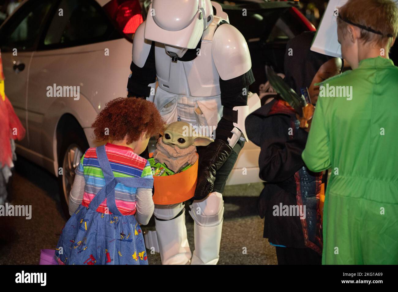 A participant of Moody’s Trunk or Treat event hands out candy at Moody ...