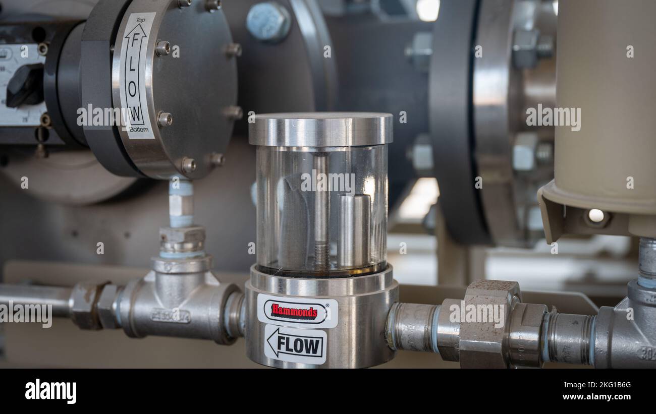 A fluid powered additive injector cart sits on the ground during a ...