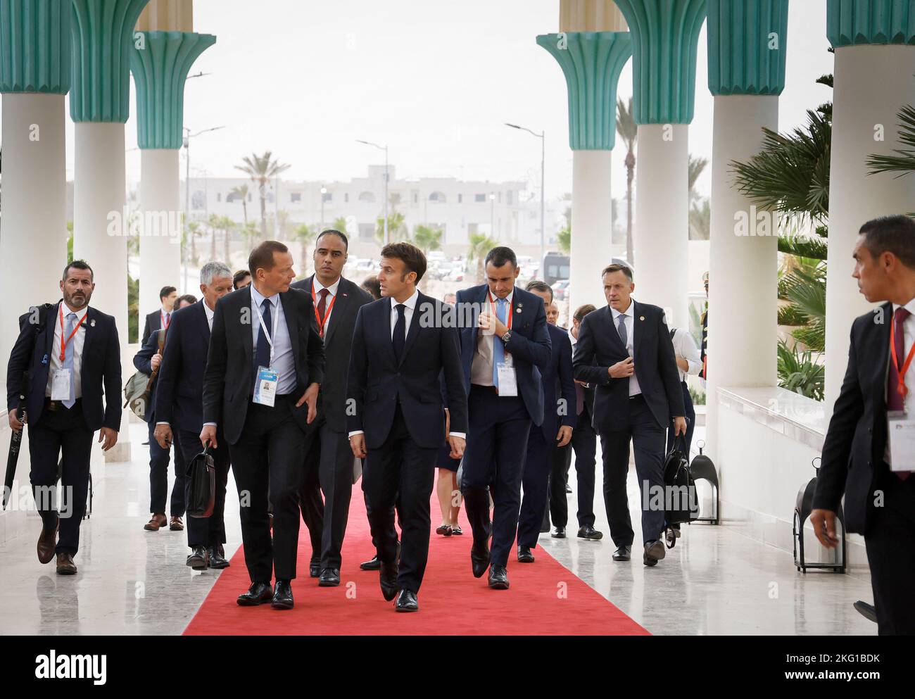 France's President Emmanuel Macron (C) talks with his advisers during ...