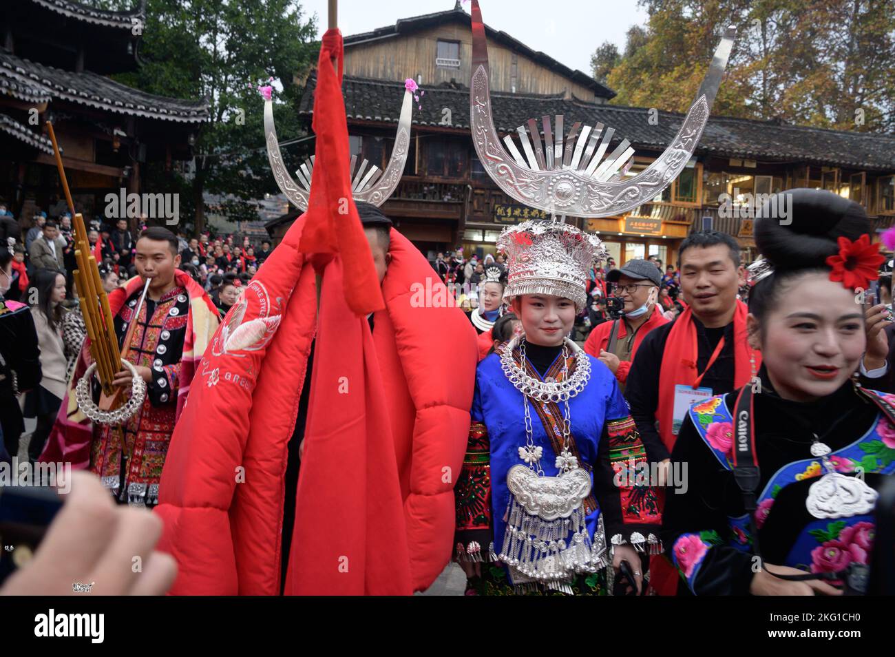 The Hmong girls in holiday attire are dancing the traditional Lusheng ...