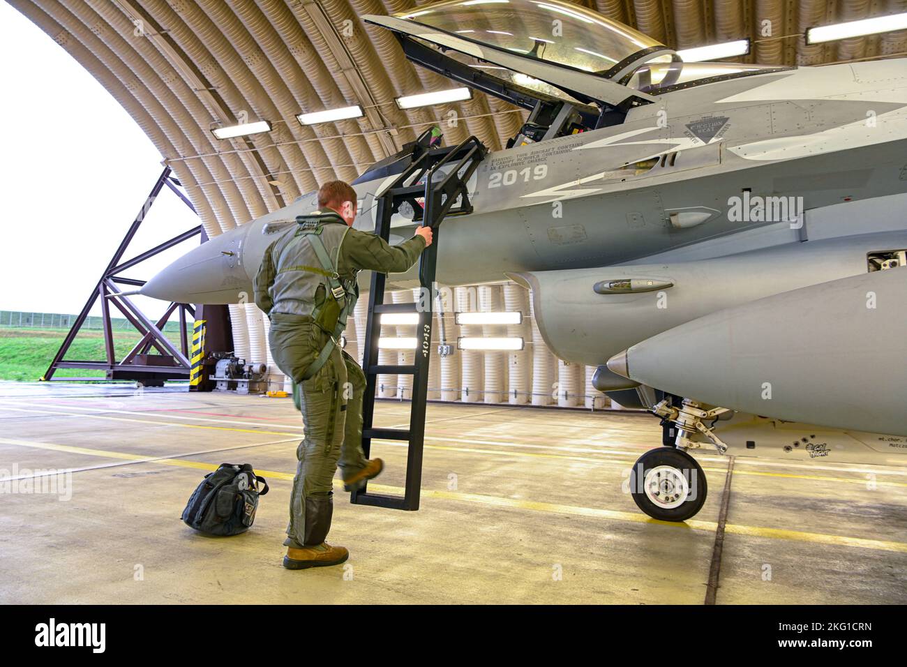 A Polish Air Force pilot prepares to board a Polish Air Force F-16 ...