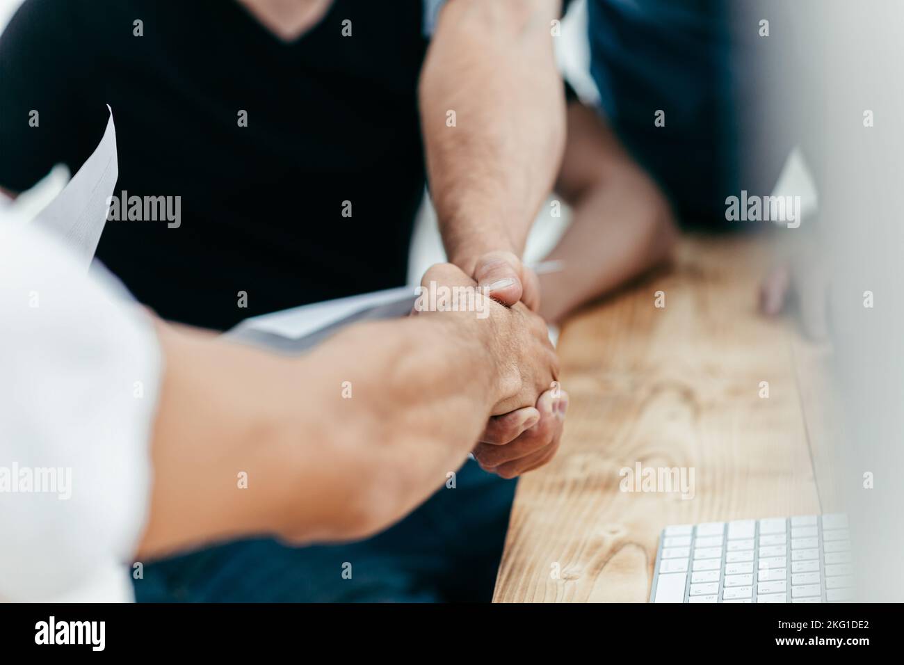 close up.the employer shaking hands with a new employee Stock Photo - Alamy