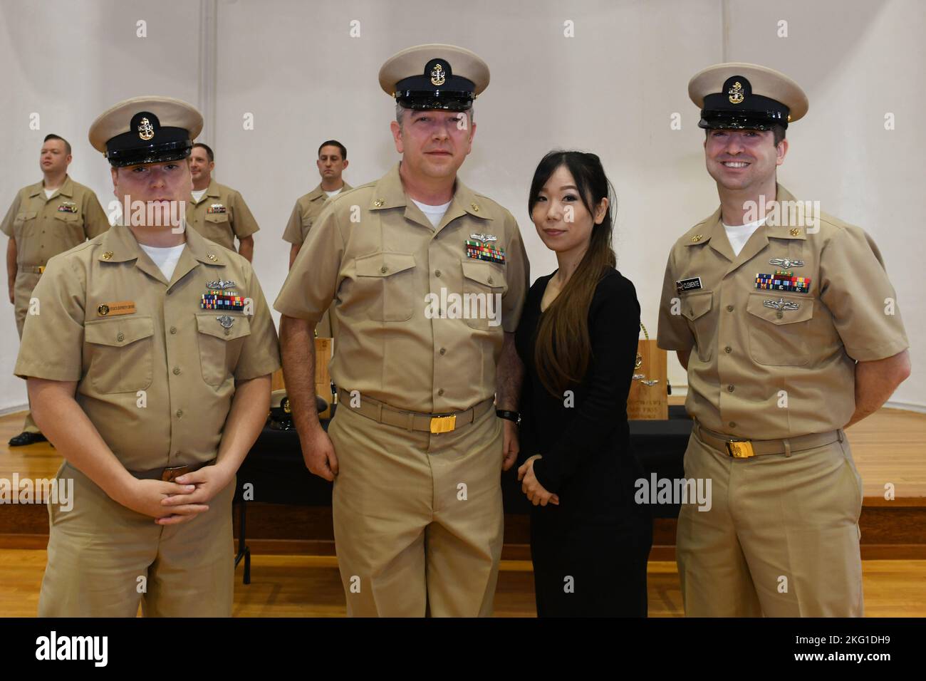 221021-N-ON904-1146 YOKOSUKA, Japan - (Oct. 21, 2022) Families and sponsors pin newly selected ...